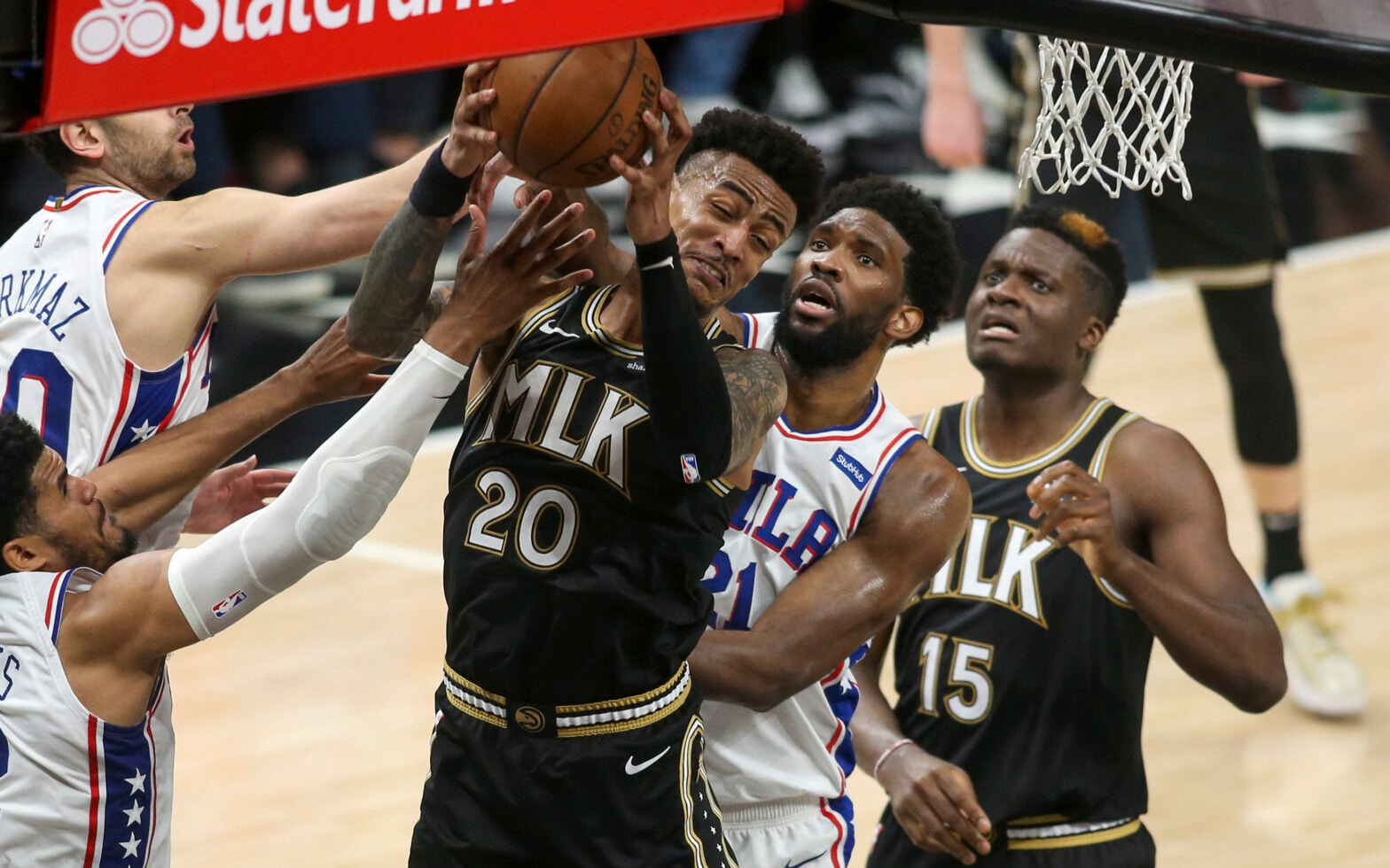 John Collins electric, Joel Embiid limited in Hawks' Game 4 victory ...
