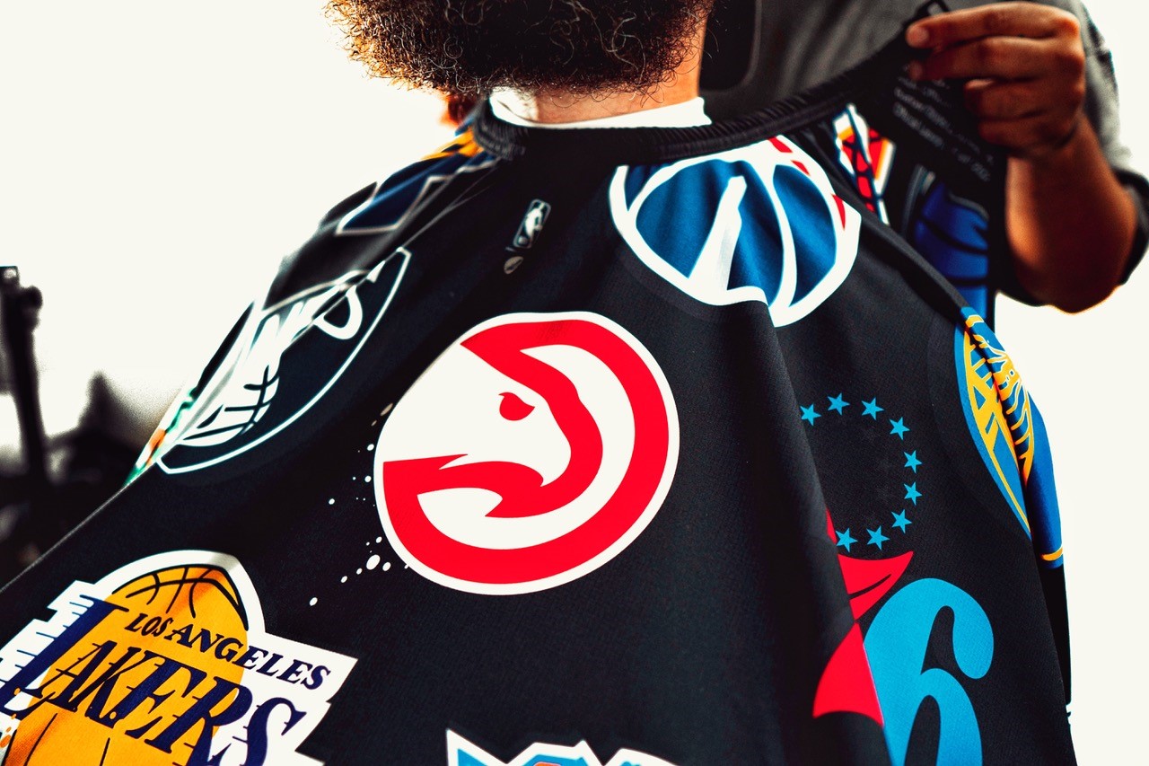 Holiday Gift Guide: The multi-logo NBA Barber cape | NBA.com