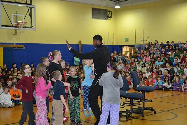 Paul George Surprises Students Photo Gallery | NBA.com
