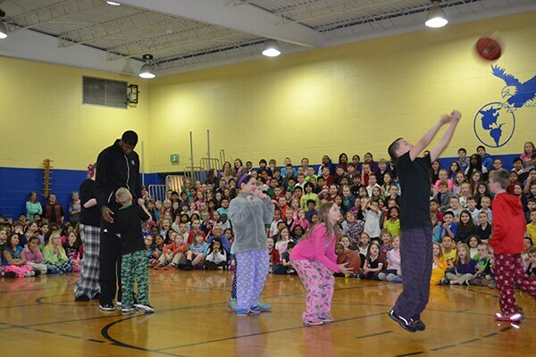 Paul George Surprises Students Photo Gallery | NBA.com