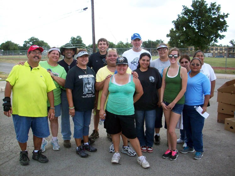 Coach Pop and SS&E POSSE Team Up with the Food Bank Photo Gallery | NBA.com