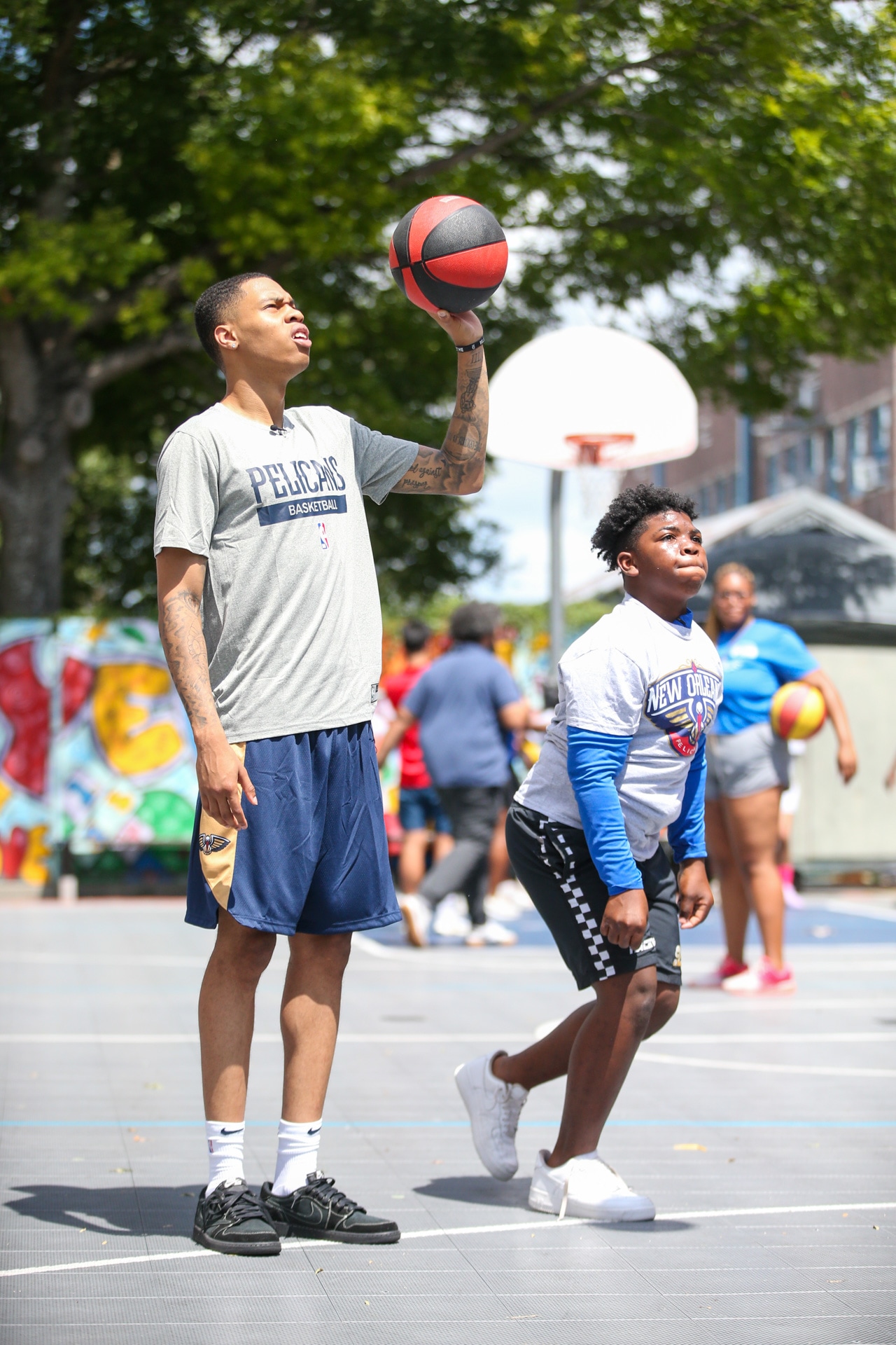 Photos: Jordan Hawkins hosts first community event with Pelicans Photo ...