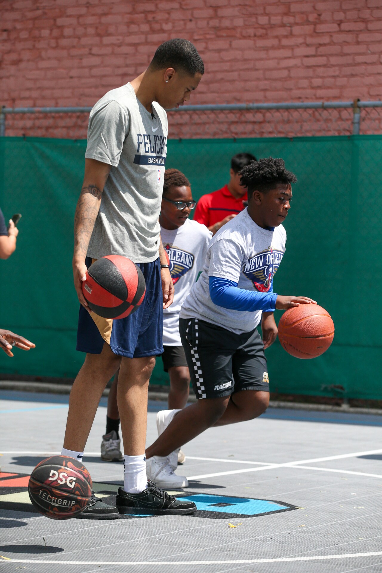 Photos: Jordan Hawkins hosts first community event with Pelicans Photo ...
