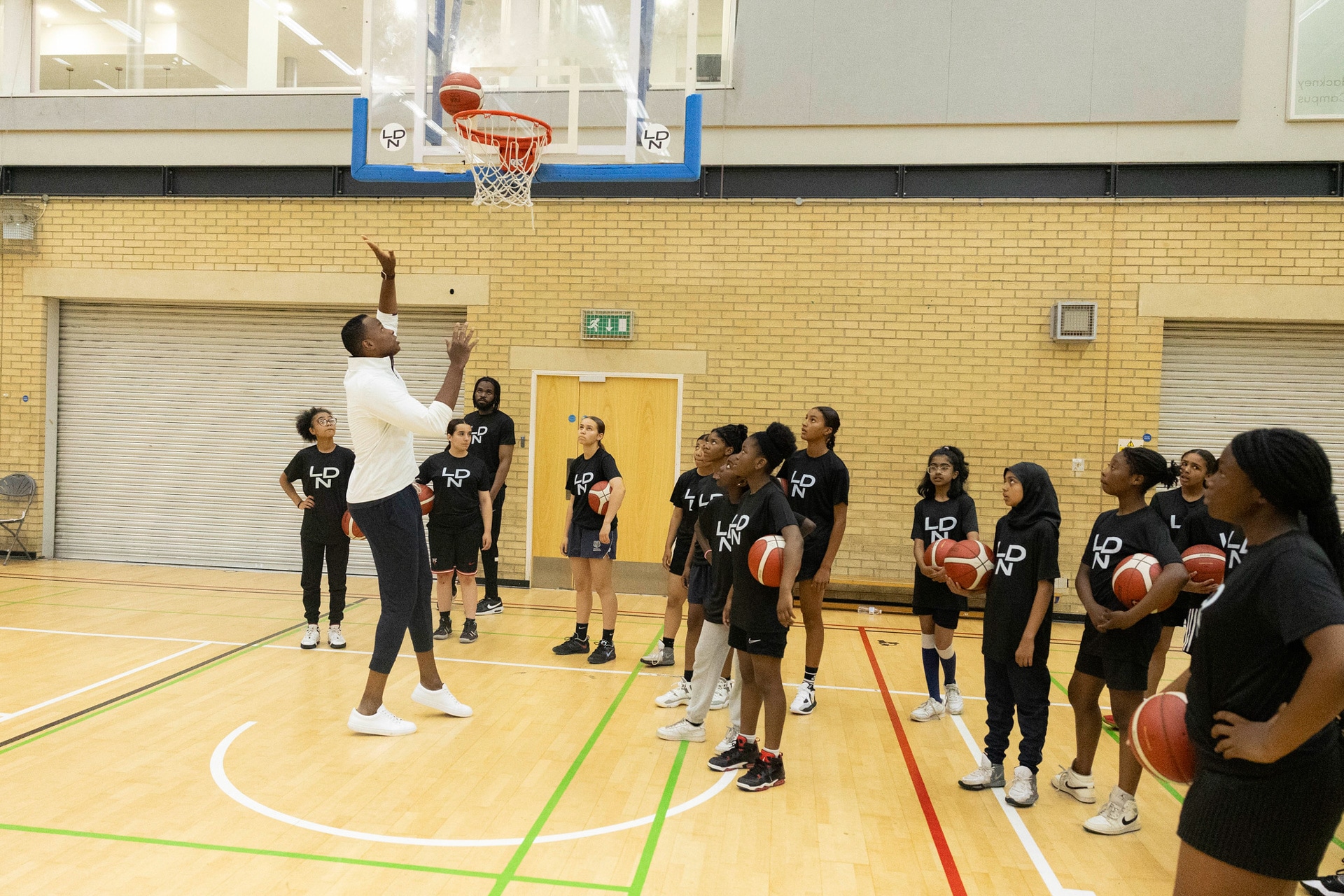 Photos: Jarron Collins serves as youth camp coach with London Lions ...