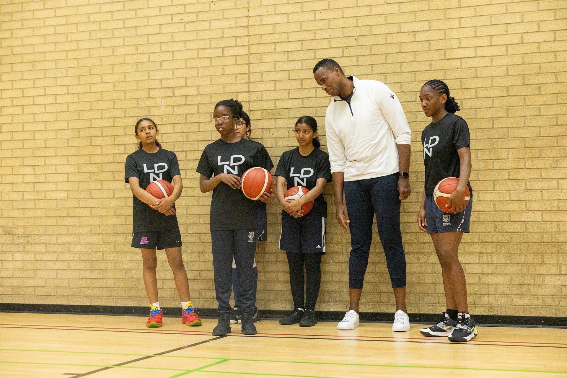 Photos: Jarron Collins serves as youth camp coach with London Lions ...