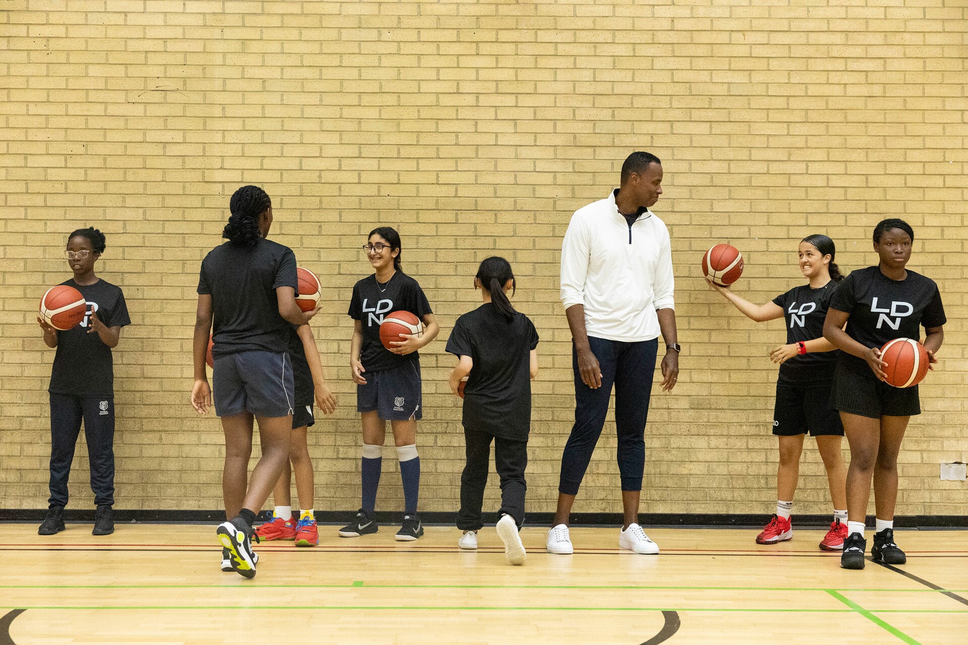 Photos: Jarron Collins serves as youth camp coach with London Lions ...