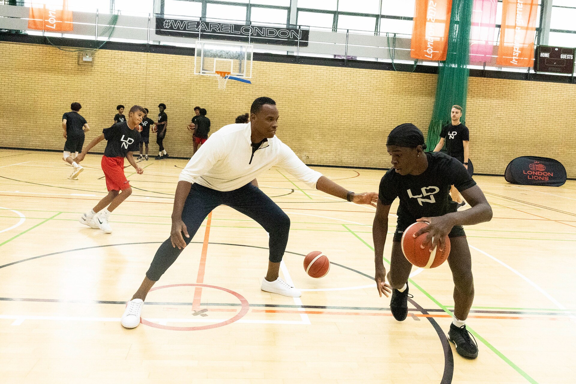 Photos: Jarron Collins serves as youth camp coach with London Lions ...