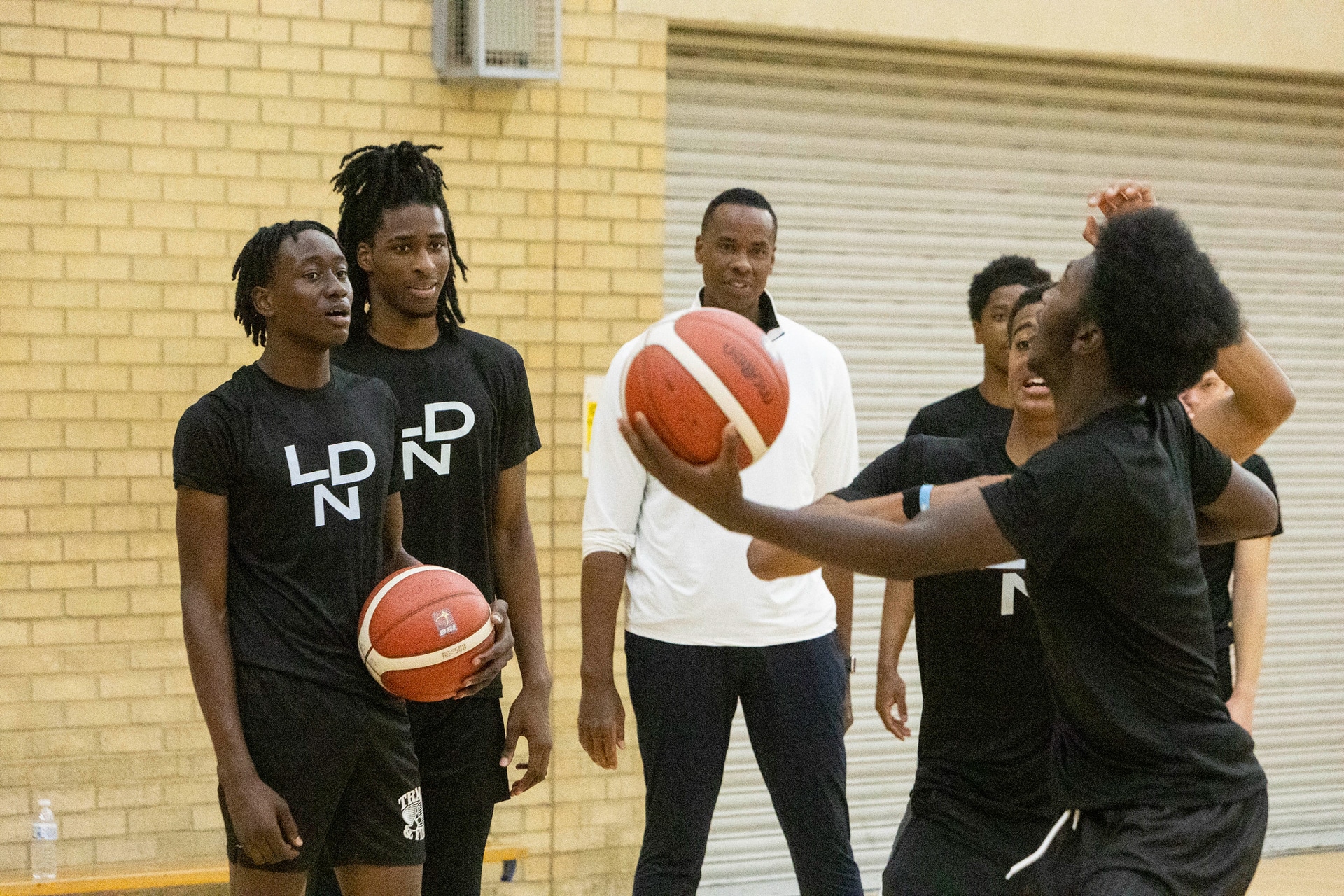 Photos: Jarron Collins serves as youth camp coach with London Lions ...