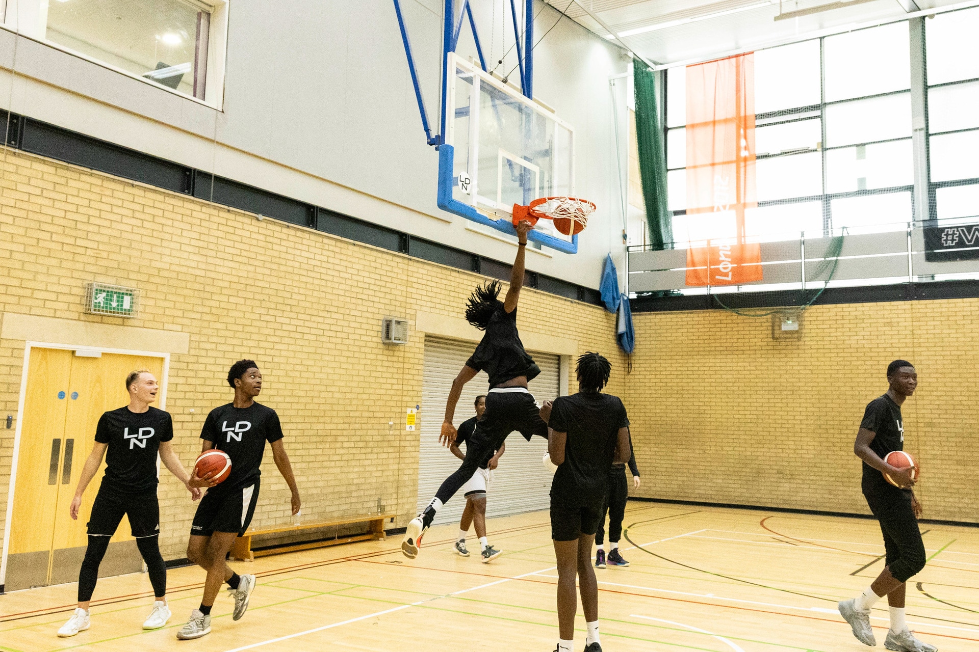 Photos: Jarron Collins serves as youth camp coach with London Lions ...