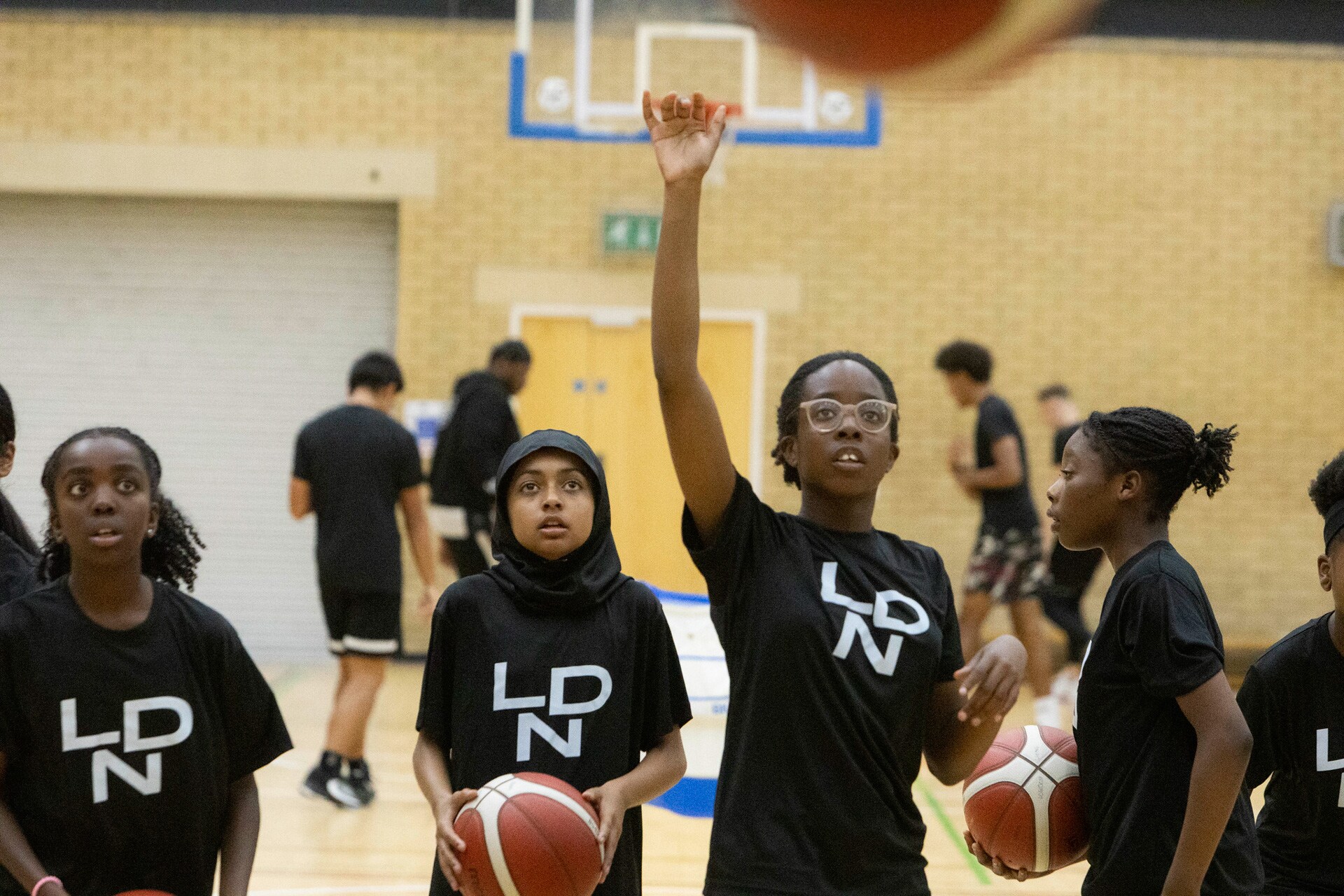 Photos: Jarron Collins serves as youth camp coach with London Lions ...