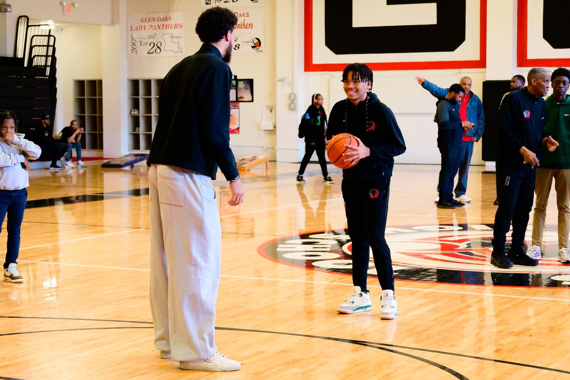 Photos: Jeremiah Robinson-Earl and his father gift basketball shoes to ...