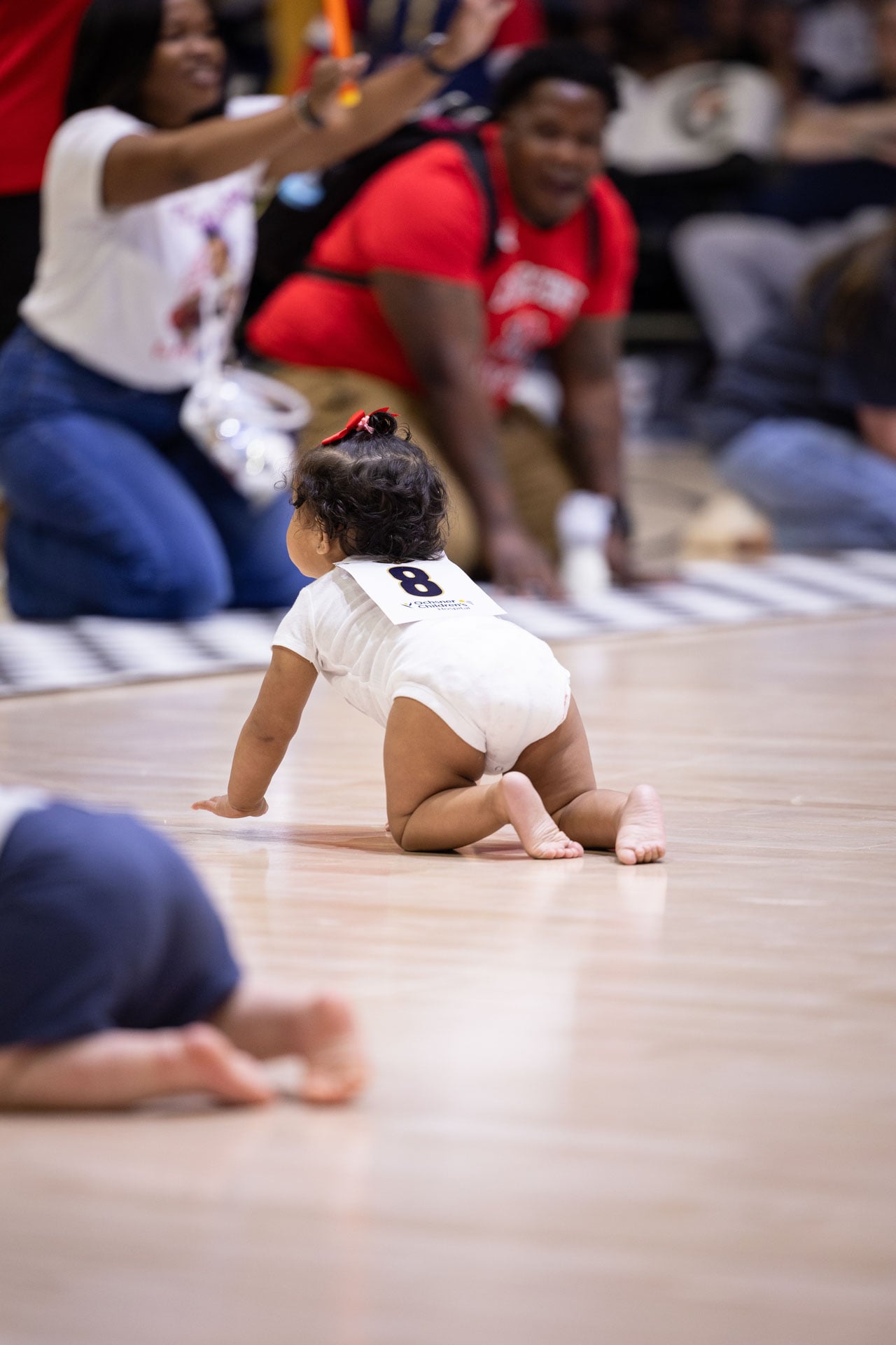 Photos: Baby Crawl Race 2024 | Pelicans vs. Celtics Entertainment 3/30 ...