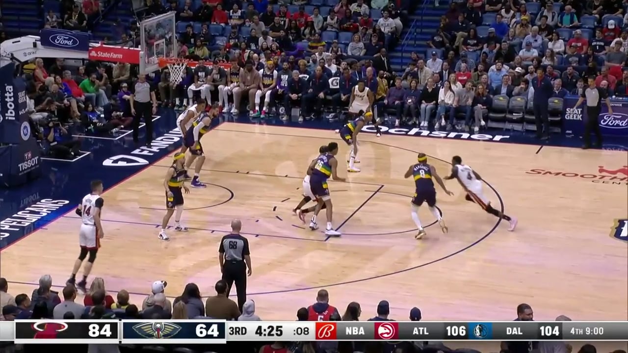 Oladipo drives by Valanciunas for the reverse layup | Miami Heat