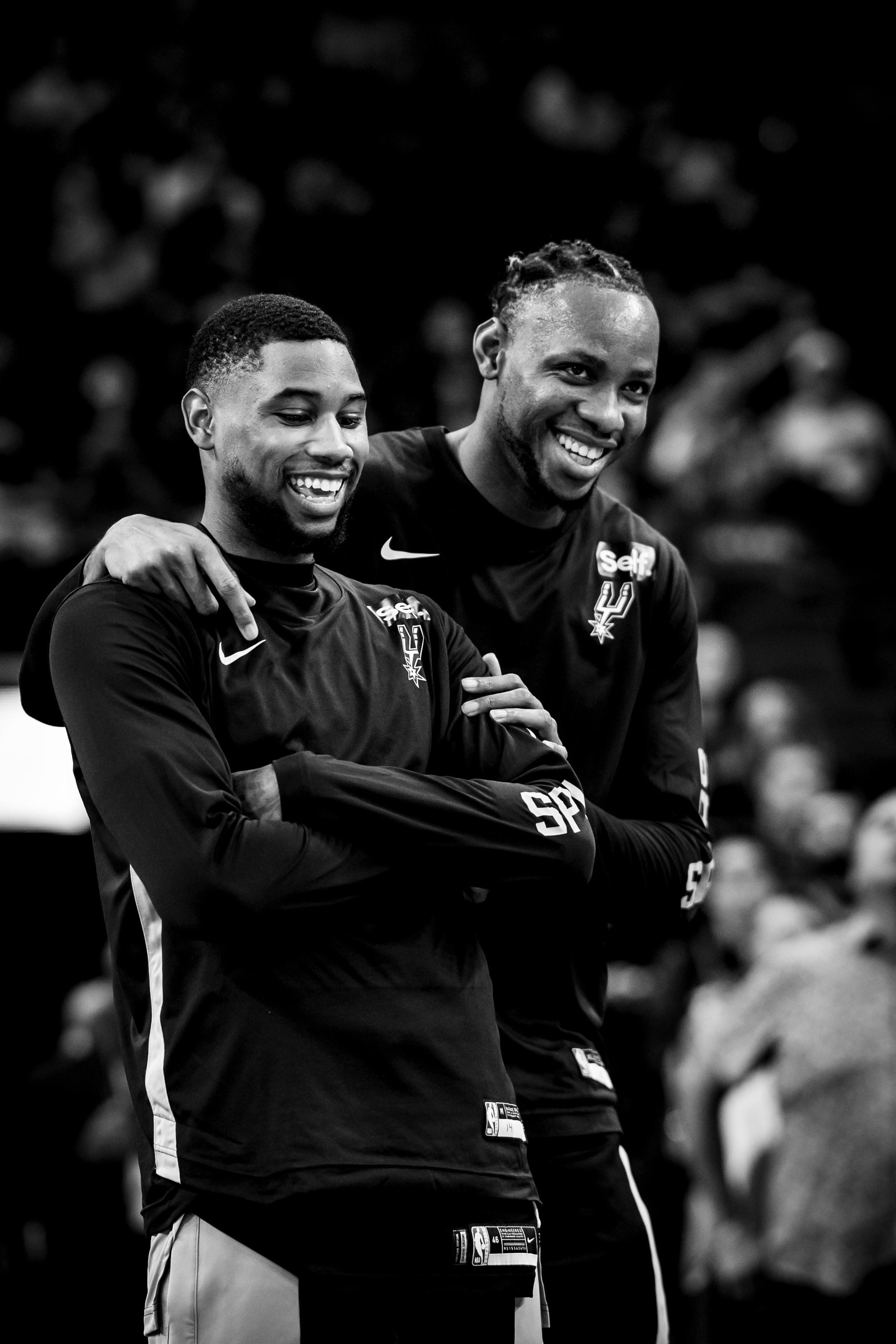San Antonio Spurs forward Charles Bassey hugs San Antonio Spurs guard ...